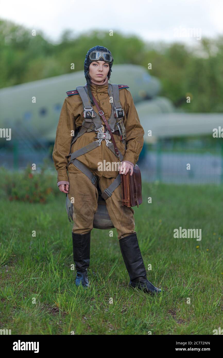 A young female pilot in uniform of Soviet Army pilots during the World ...