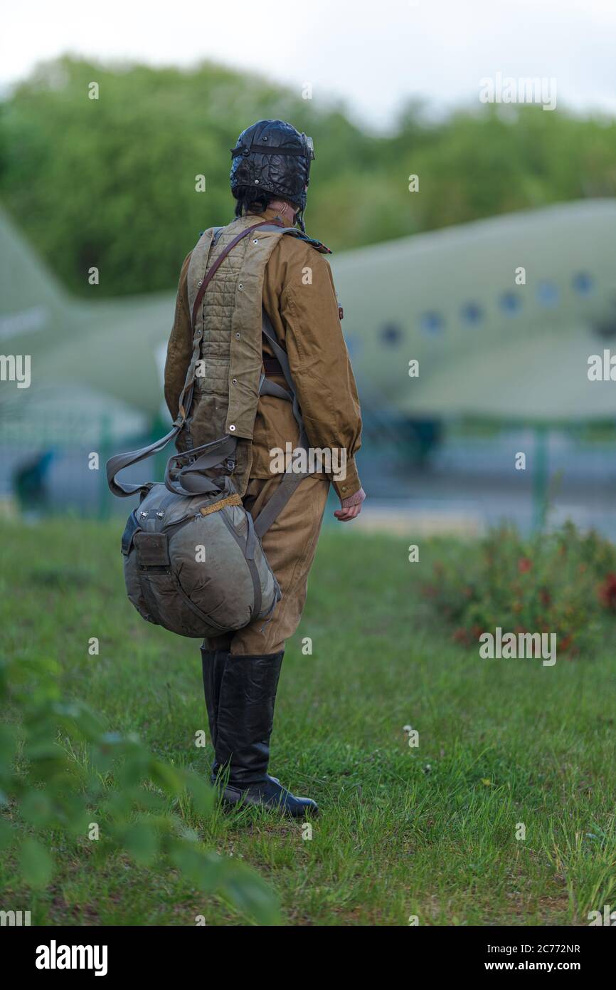 A young female pilot in uniform of Soviet Army pilots during the World ...
