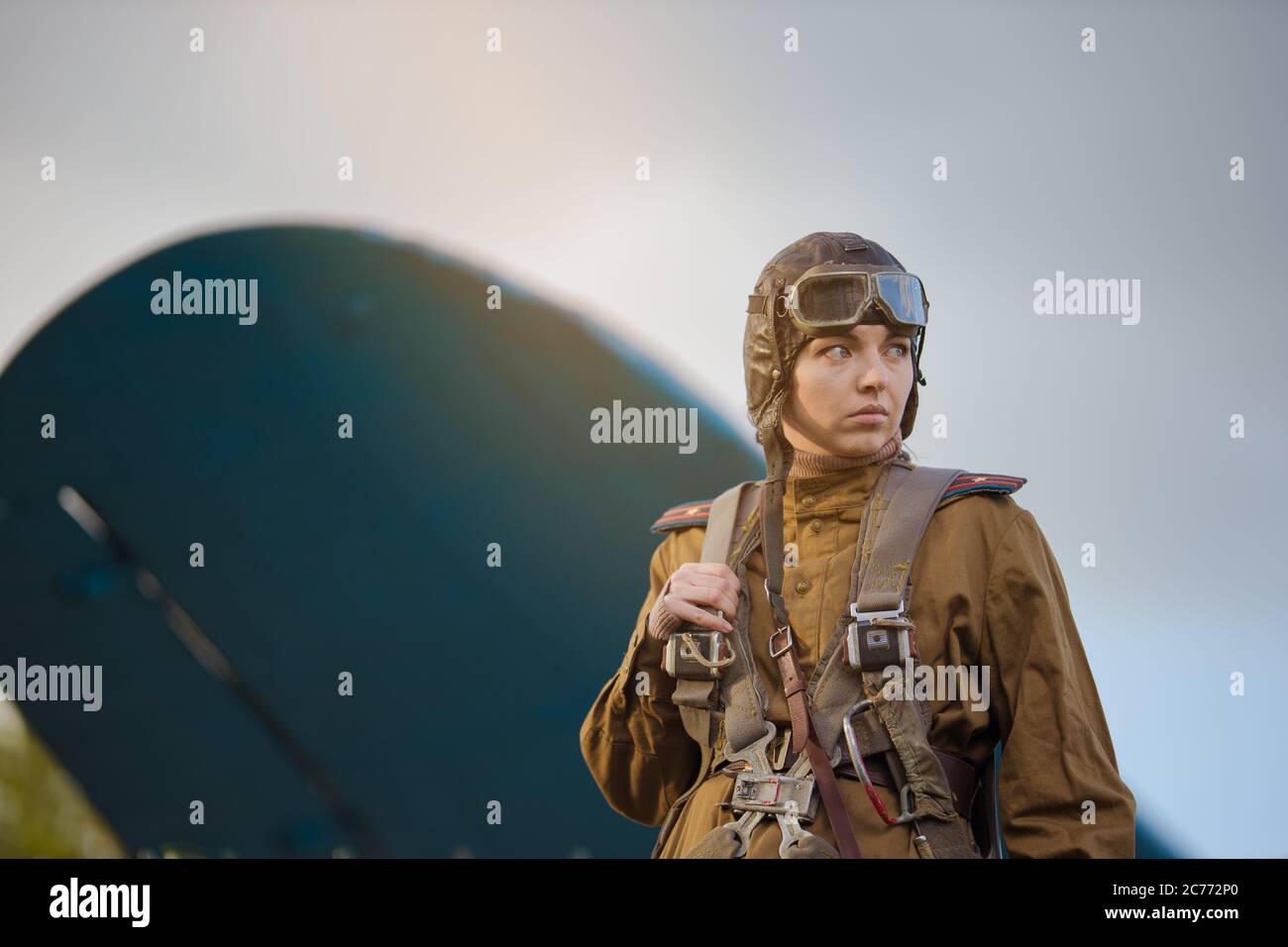 A young female pilot in uniform of Soviet Army pilots during the World ...