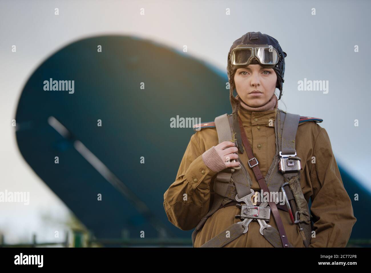A young female pilot in uniform of Soviet Army pilots during the World ...