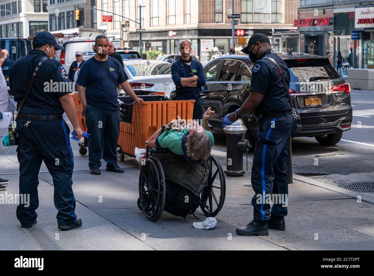 New York, NY - July 14, 2020: Paramedics attend sick homeless man on ...