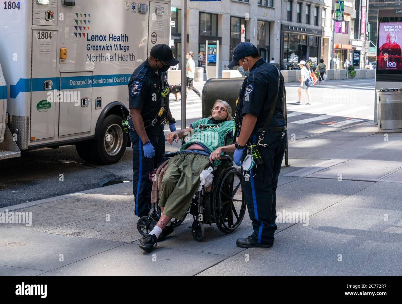 New York, NY - July 14, 2020: Paramedics attend sick homeless man on ...