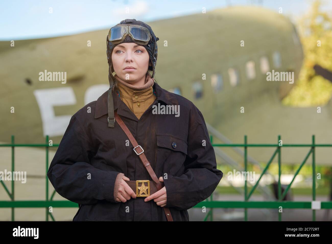 A young female pilot in uniform of Soviet Army pilots during the World ...
