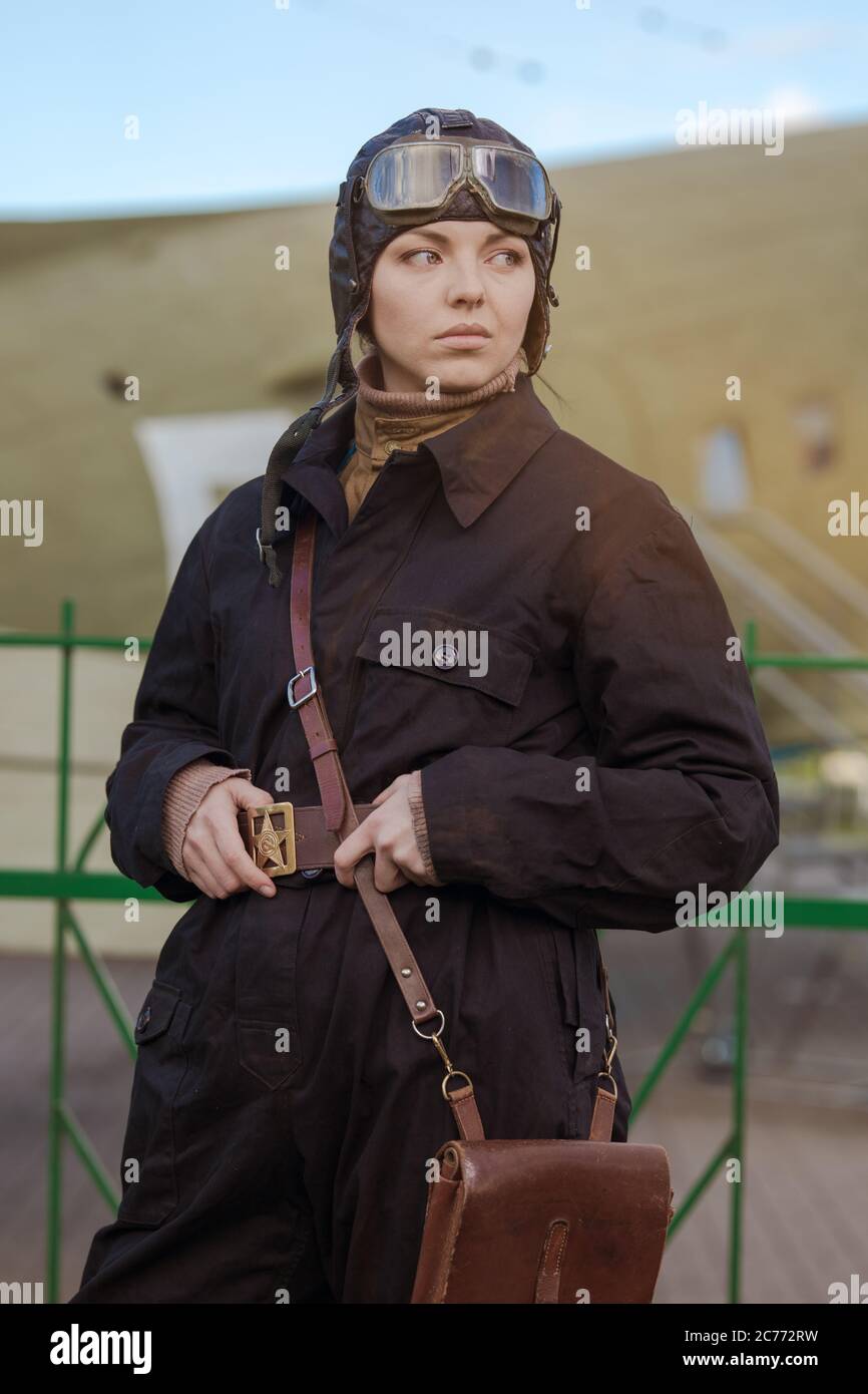 A young female pilot in uniform of Soviet Army pilots during the World ...