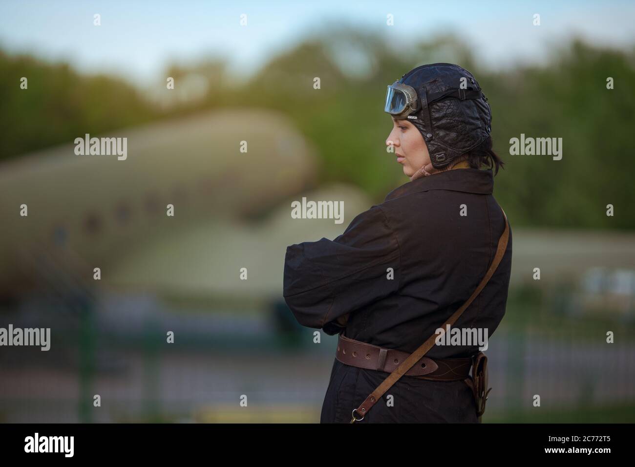 A young female pilot in uniform of Soviet Army pilots during the World ...