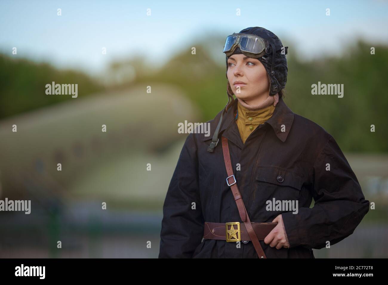 A young female pilot in uniform of Soviet Army pilots during the World ...