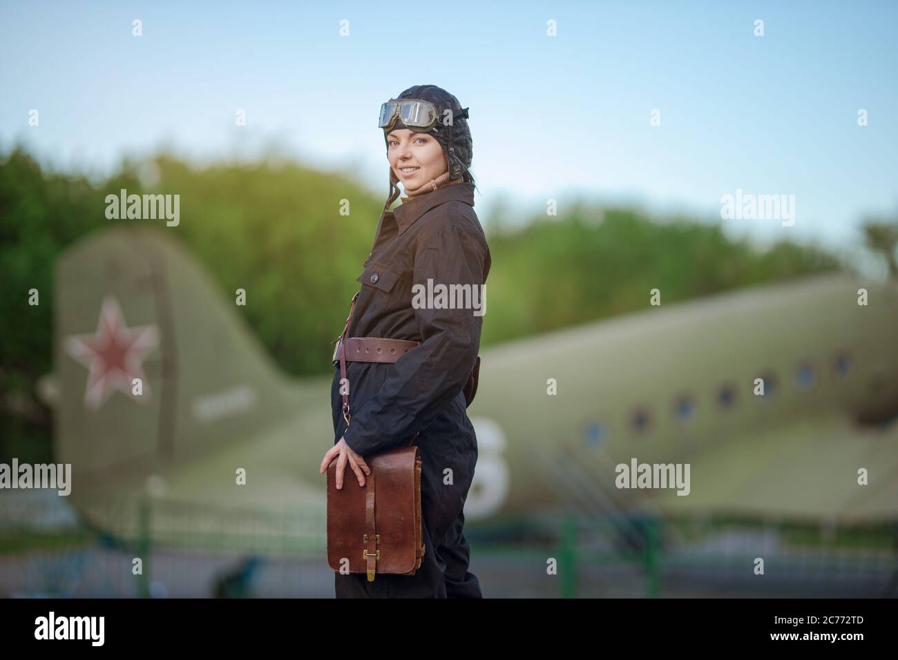 A young female pilot in uniform of Soviet Army pilots during the World ...