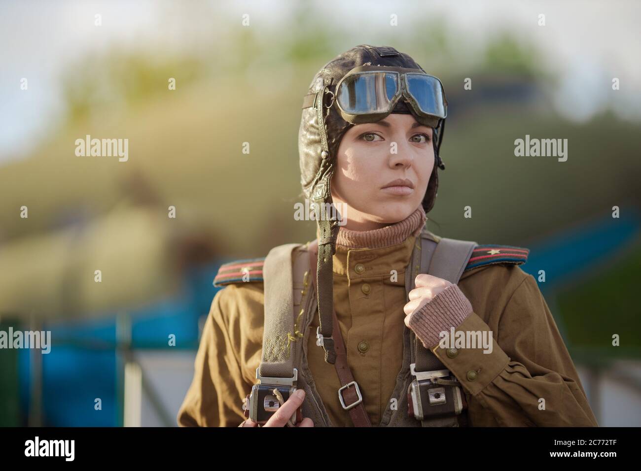 A young female pilot in uniform of Soviet Army pilots during the World ...
