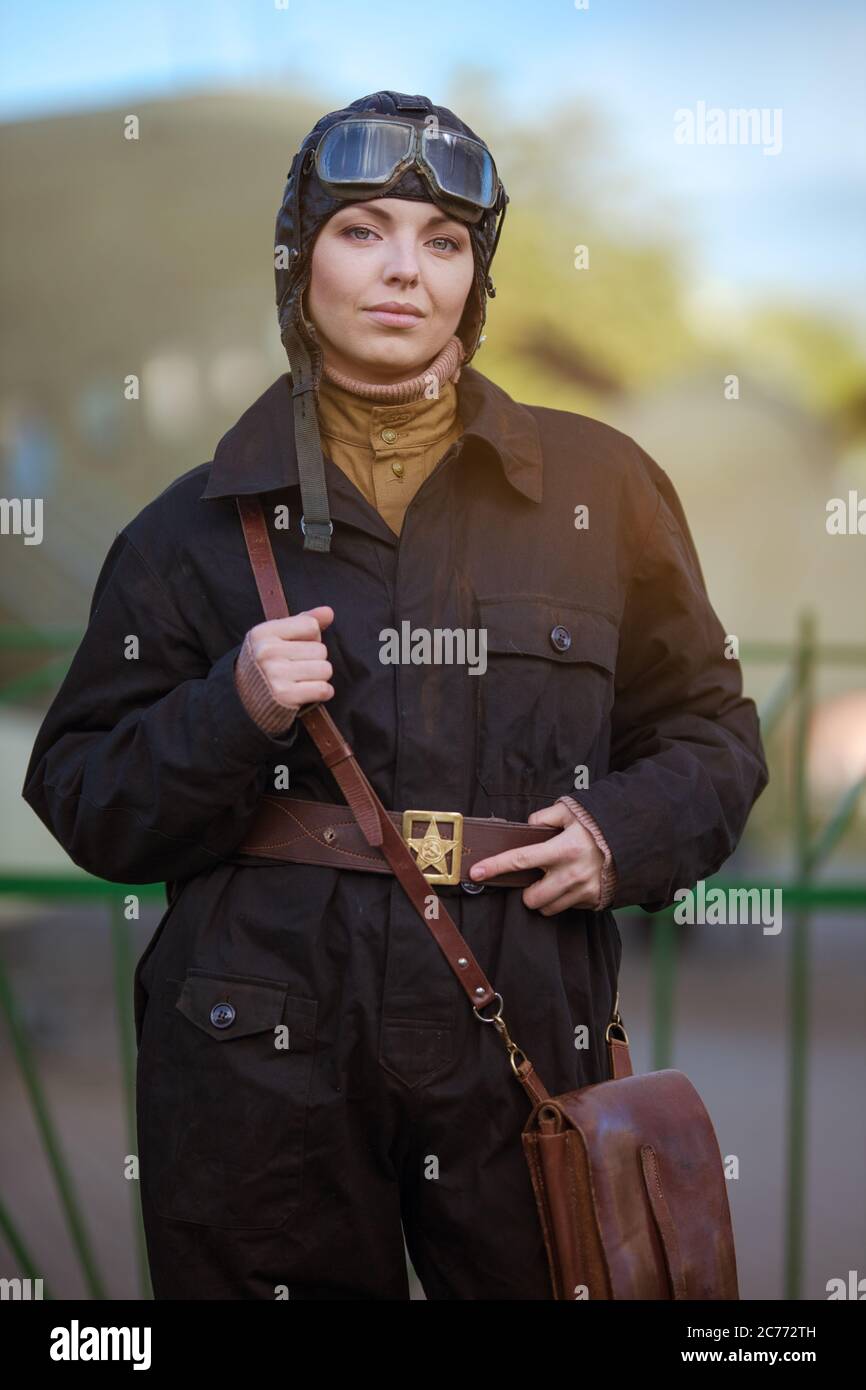 A young female pilot in uniform of Soviet Army pilots during the World ...