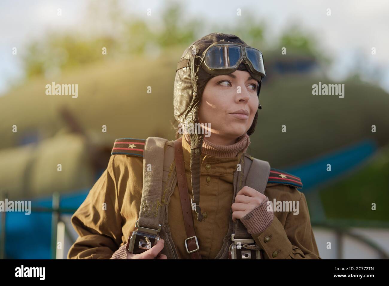 A young female pilot in uniform of Soviet Army pilots during the World ...