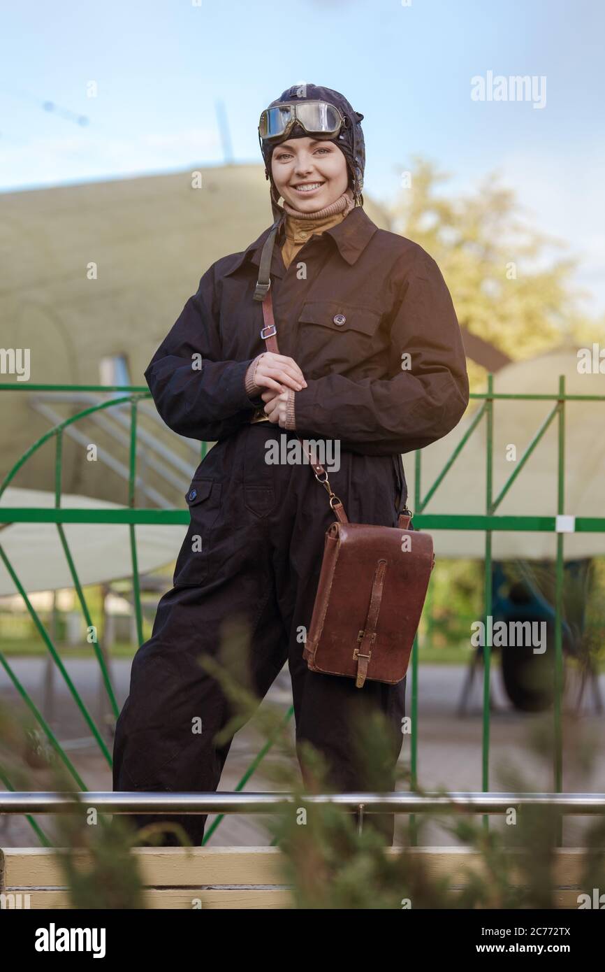 A young female pilot in uniform of Soviet Army pilots during the World ...