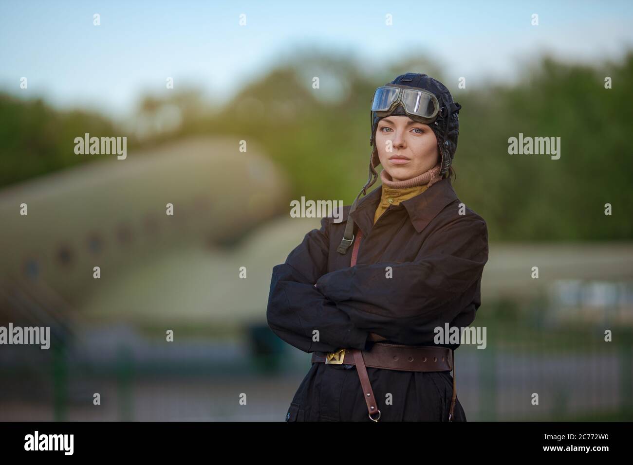 A young female pilot in uniform of Soviet Army pilots during the World ...