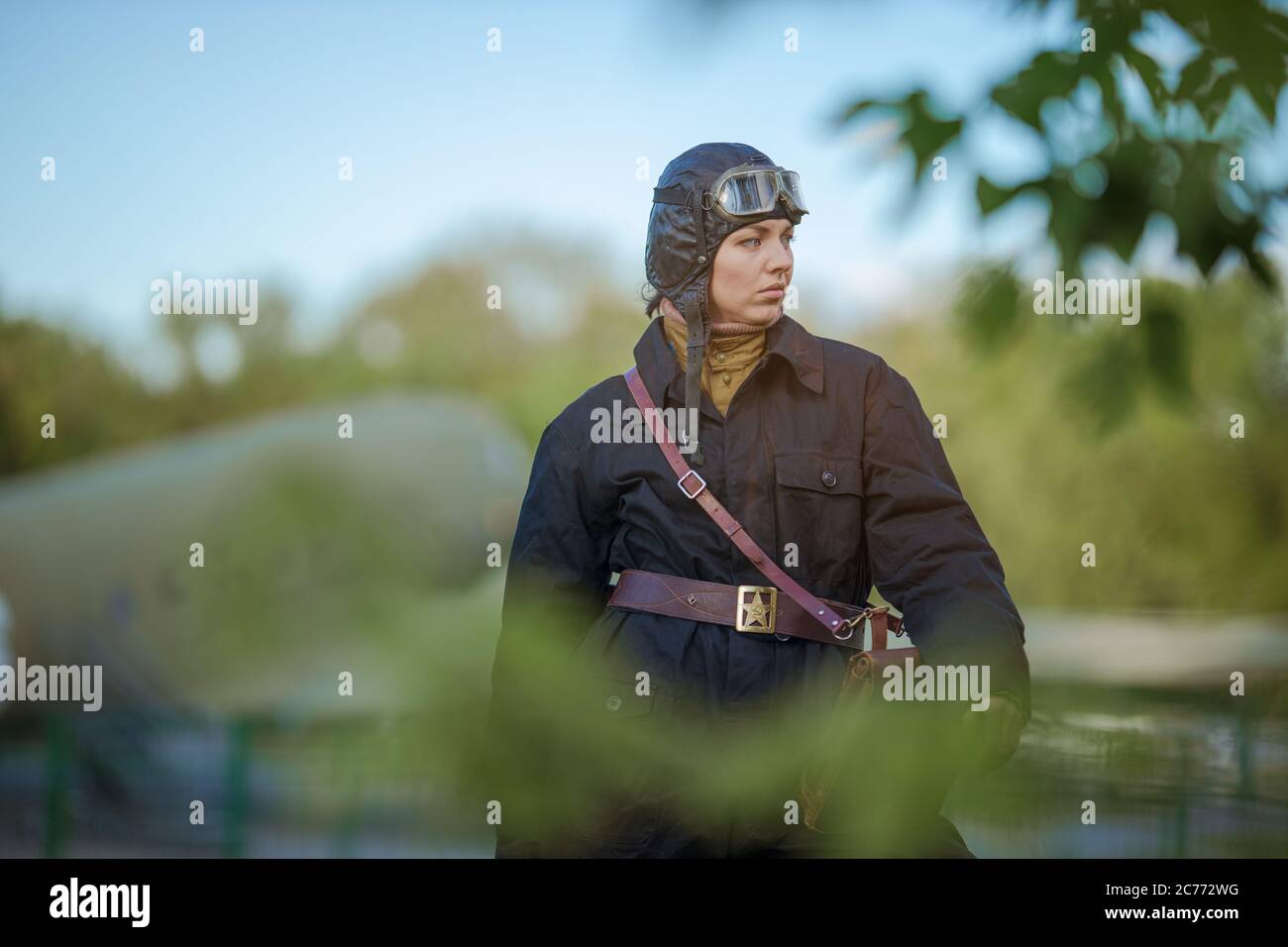 A young female pilot in uniform of Soviet Army pilots during the World ...
