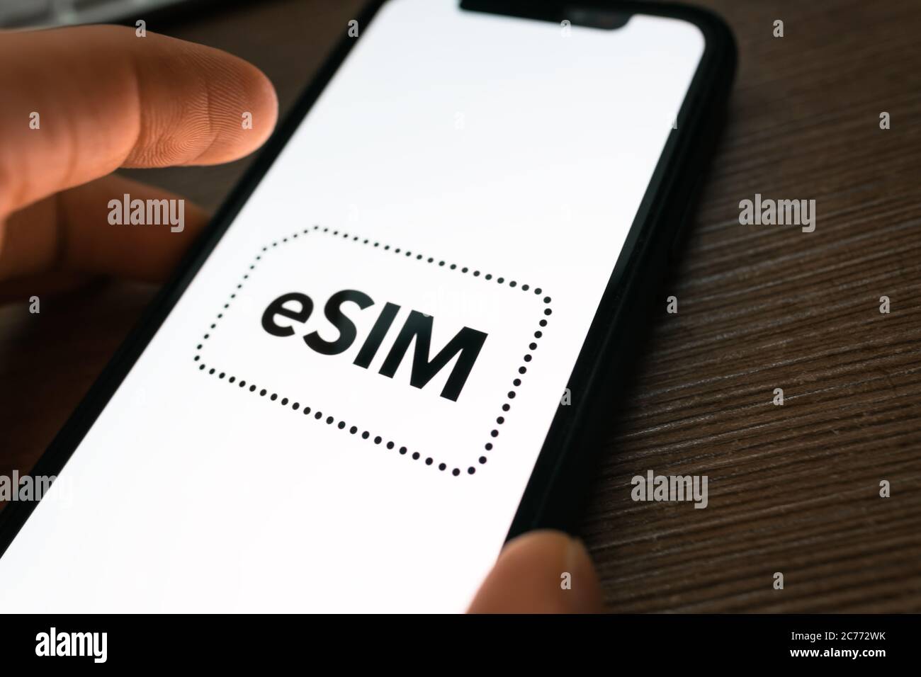 eSIM card chip logo on the smartphone screen Stock Photo - Alamy