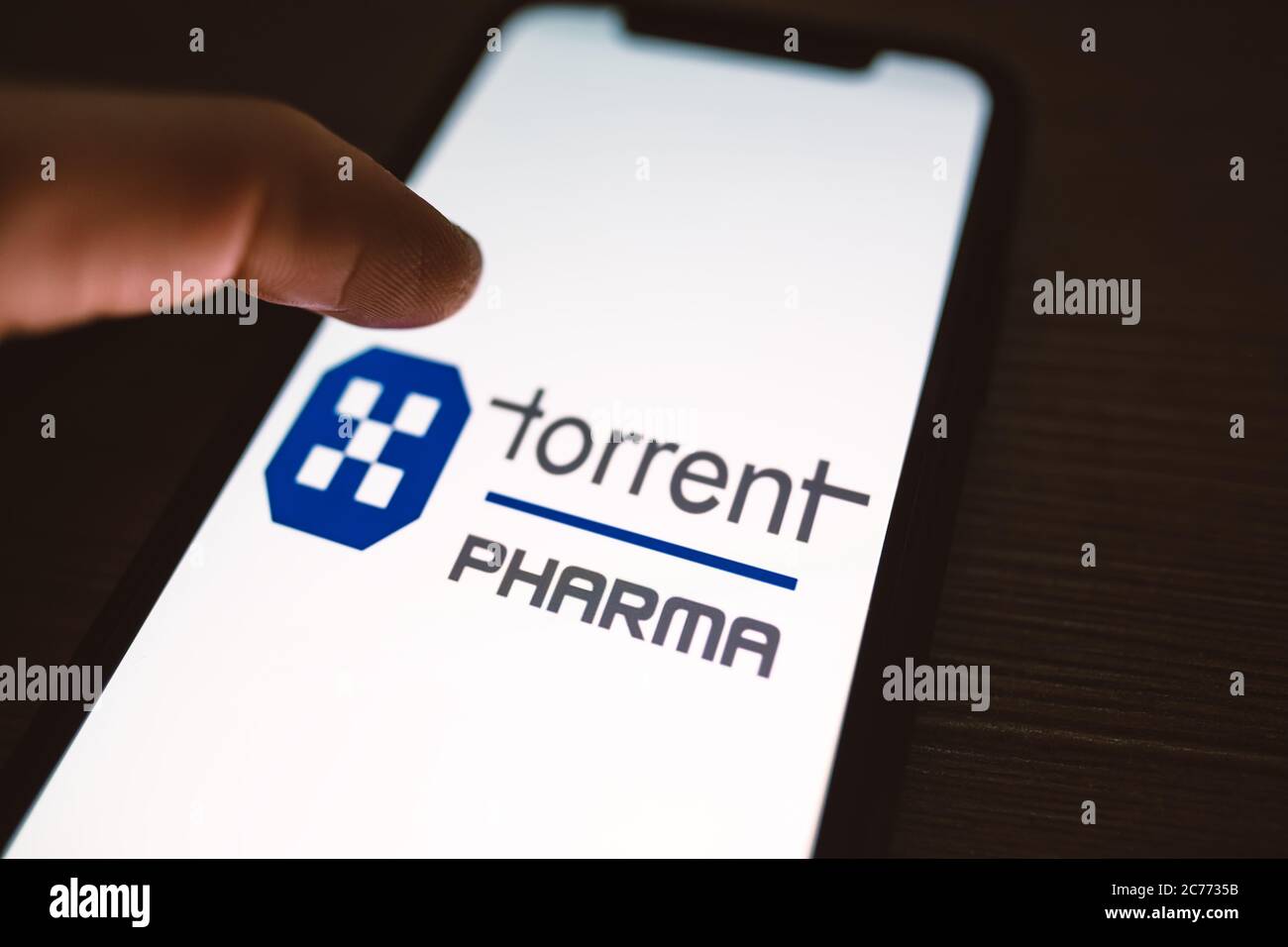 Smartphone with torrent Pharma logo on the screen Stock Photo - Alamy