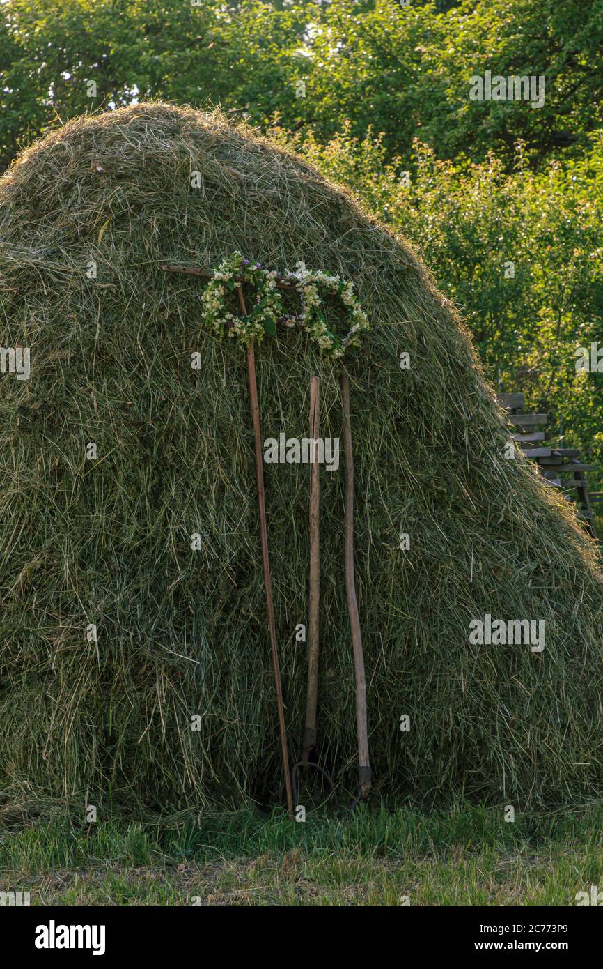 Flower crown on old grass wall at midsummer festival time Stock Photo ...