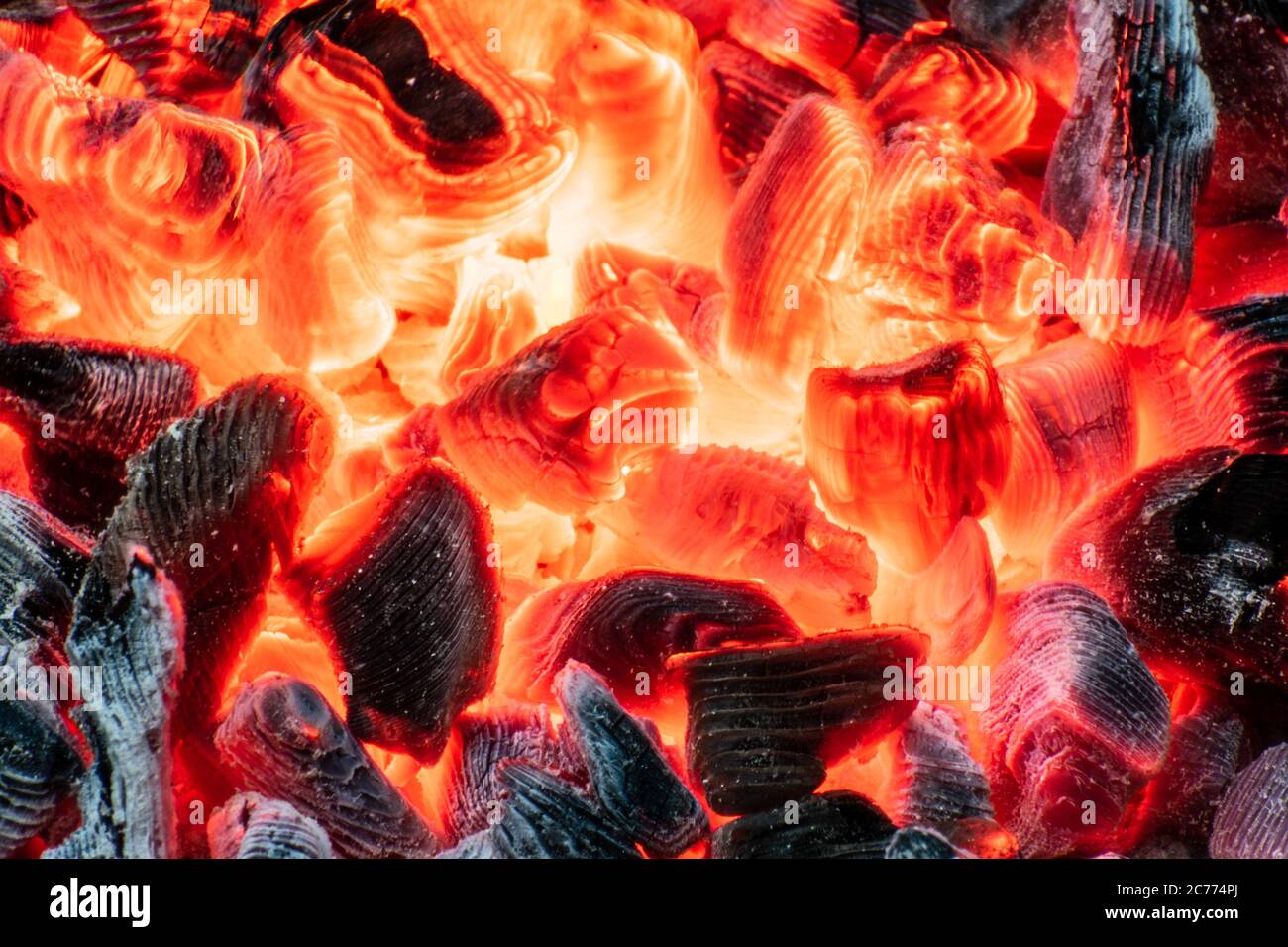 Hot coals burning orange in campfire with ash Stock Photo - Alamy