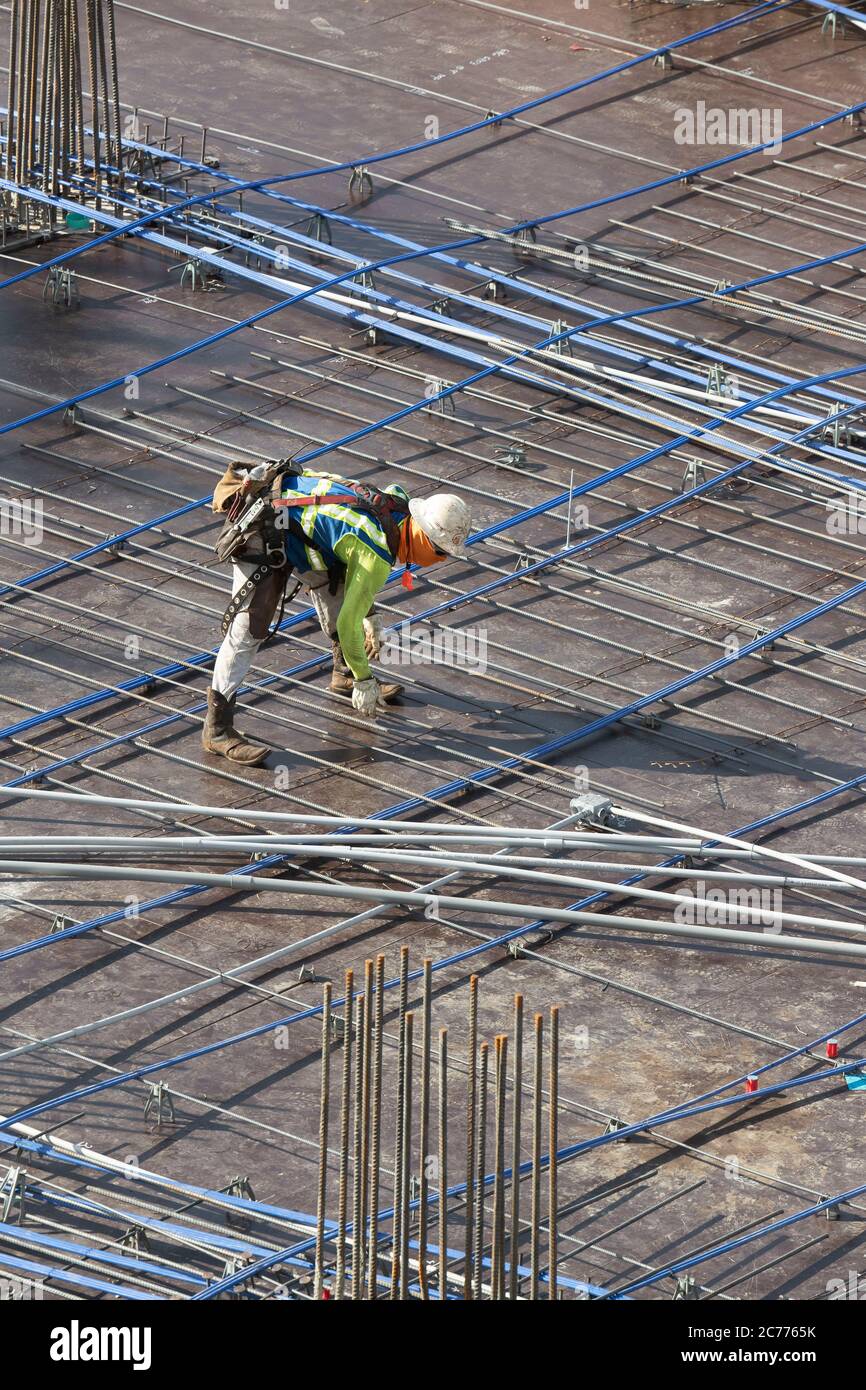 Construction workers and concrete specialists at work on the lower ...