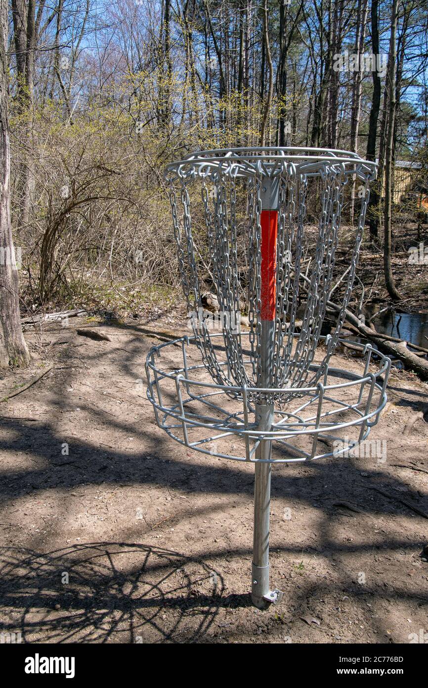 metal disc golf cage in spring woods Stock Photo - Alamy