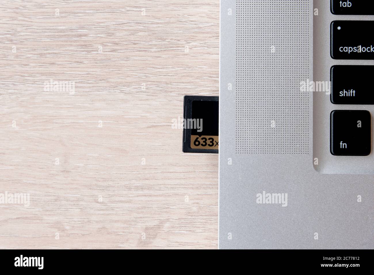 memory card of camera in laptop to transfer photos Stock Photo - Alamy