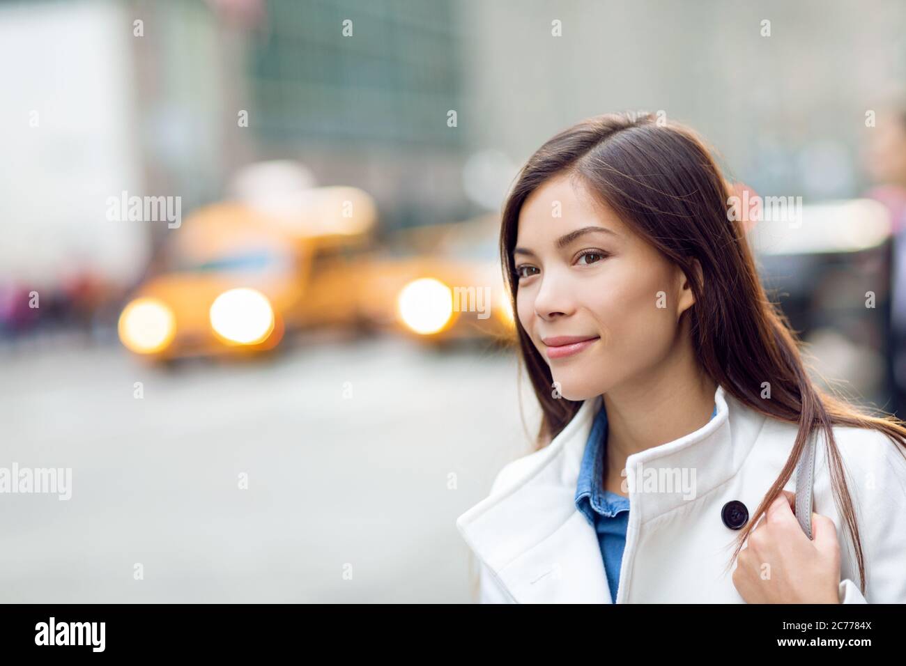 New Yorker woman walking on New York City street waiting for car lift ...