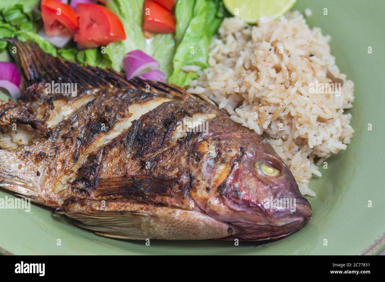 Mojarra garlic mojo tilapia fish hi-res stock photography and images ...