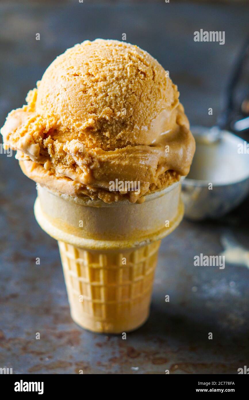 Salted caramel ice cream cone Stock Photo - Alamy