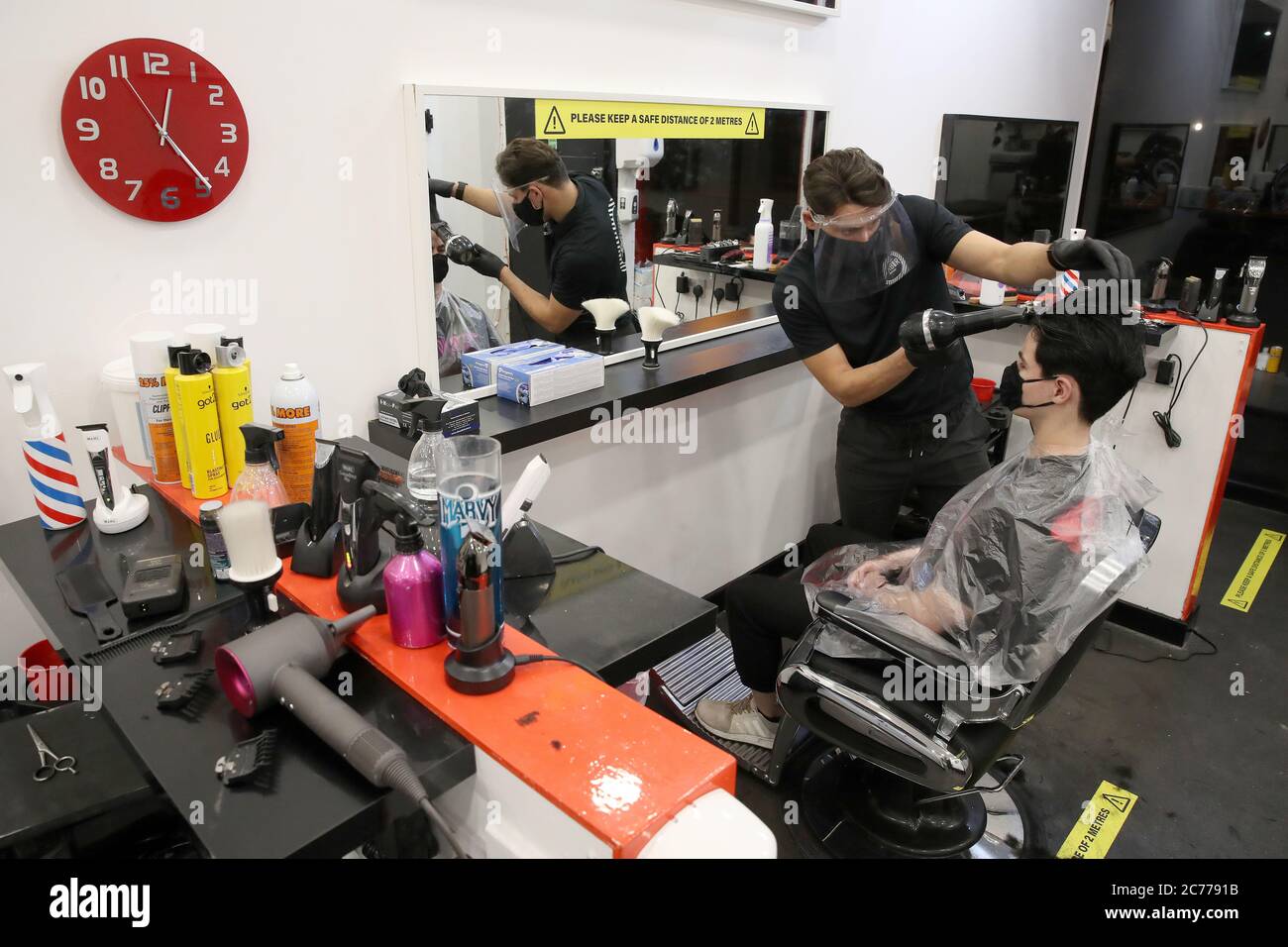 Barber Tony Mann with customer Sean Munro in the chair at Tony Mann's ...