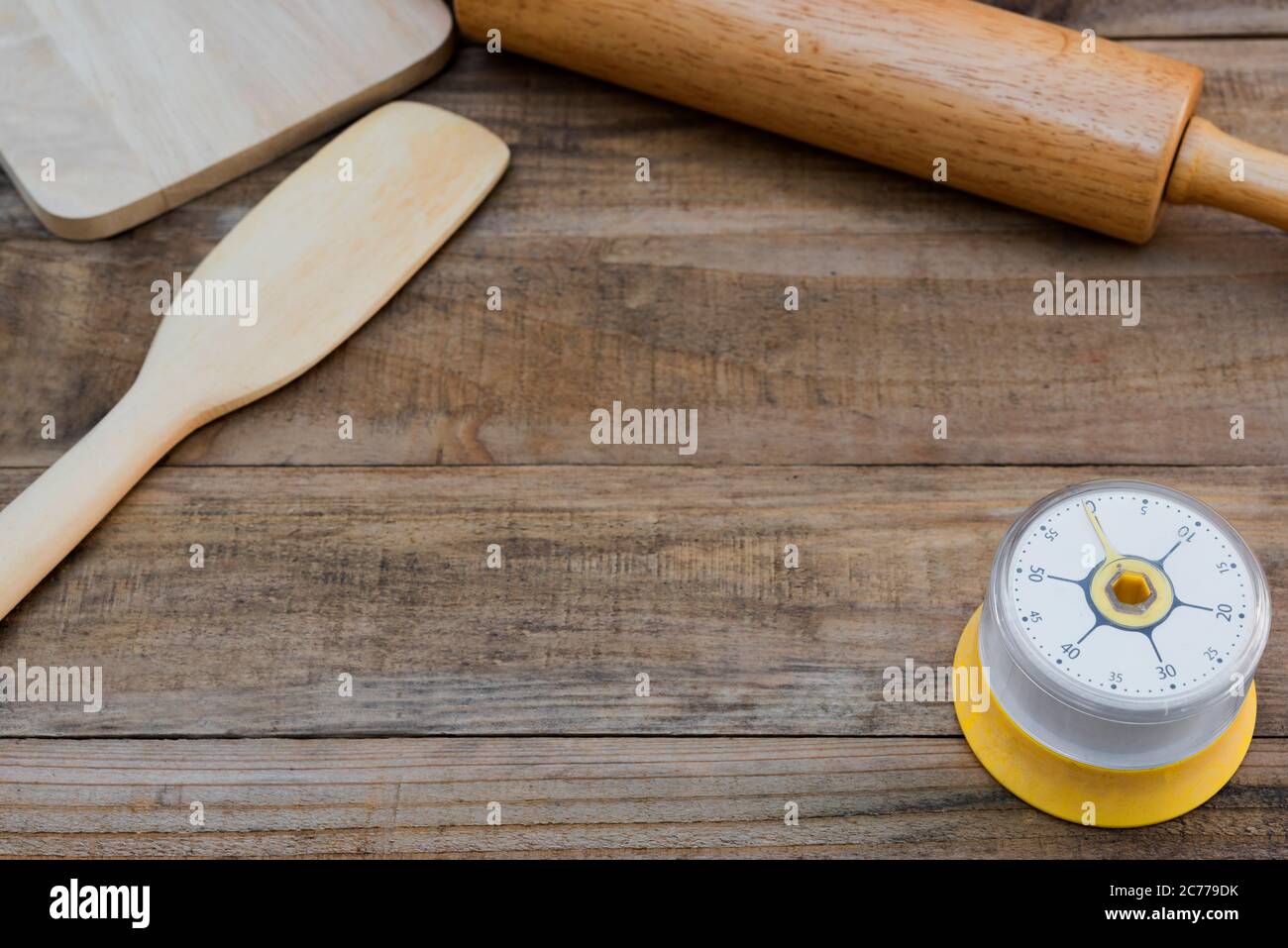 Bakery And Cooking Tools with kitchen timer on wood table Stock Photo ...
