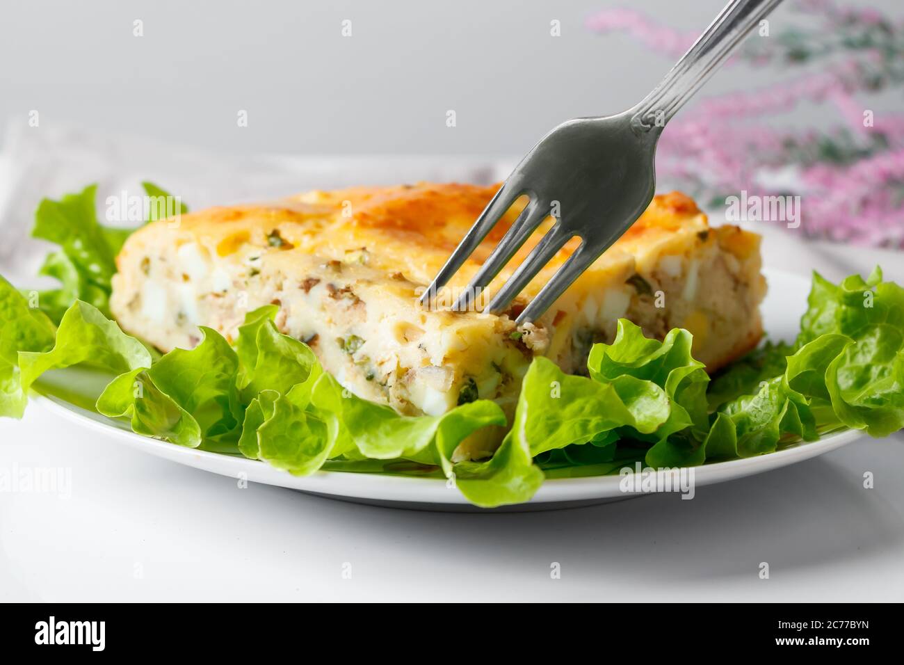 Delicious homemade fish pie with greens on a plate. Mediterranean dish ...