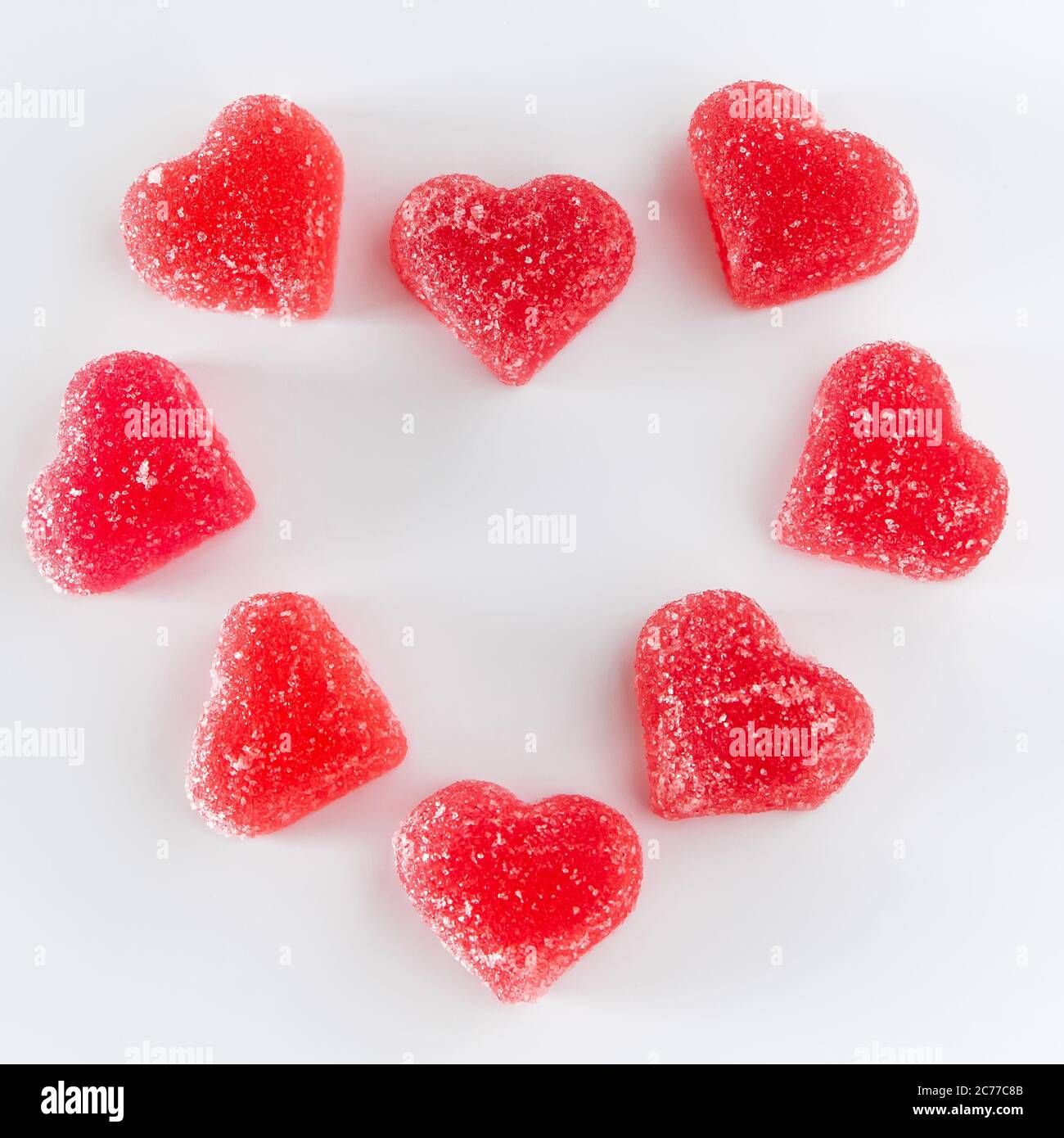 Heart shaped jelly on a white background. Arrangement of sweets for ...