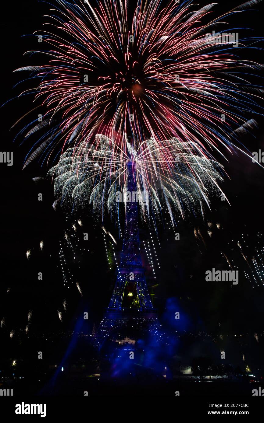 Paris, France. 14th July, 2020. Fireworks explode near the Eiffel Tower ...