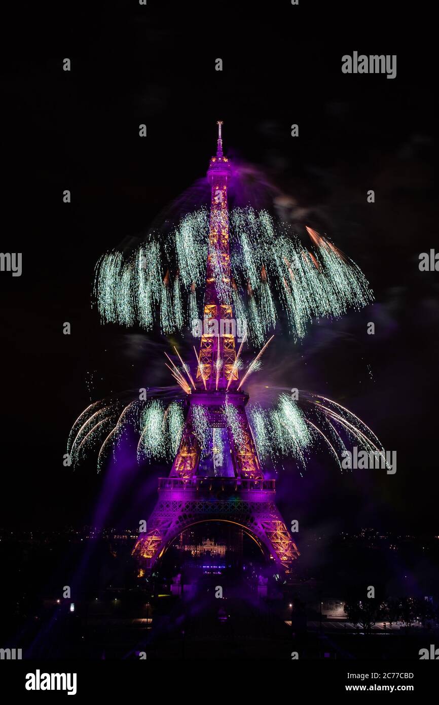 Paris, France. 14th July, 2020. Fireworks explode near the Eiffel Tower during the Bastille Day ...
