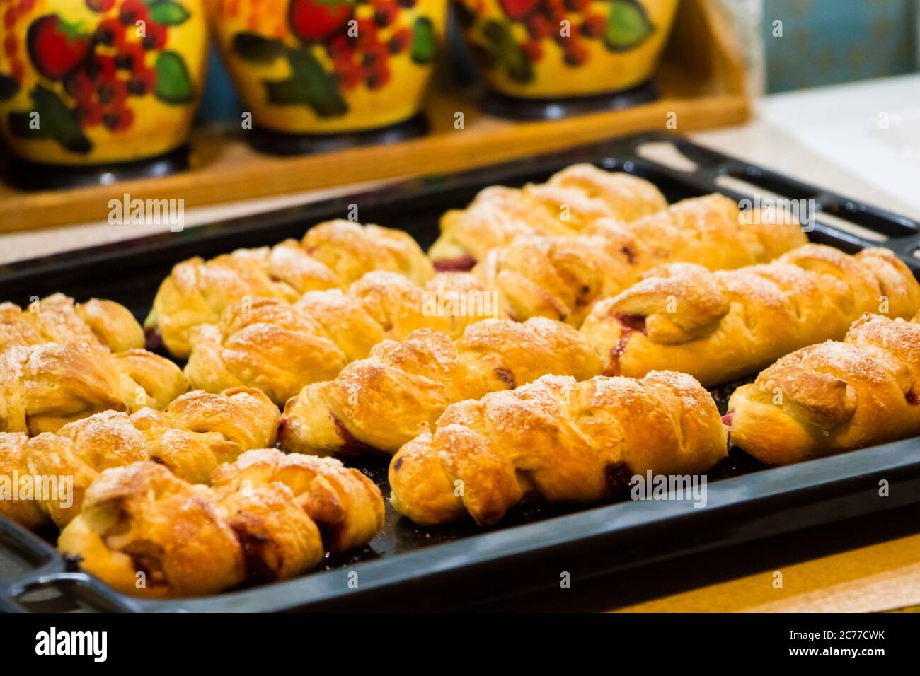Croissants made of puff pastry stuffed with dark gooseberries Stock ...