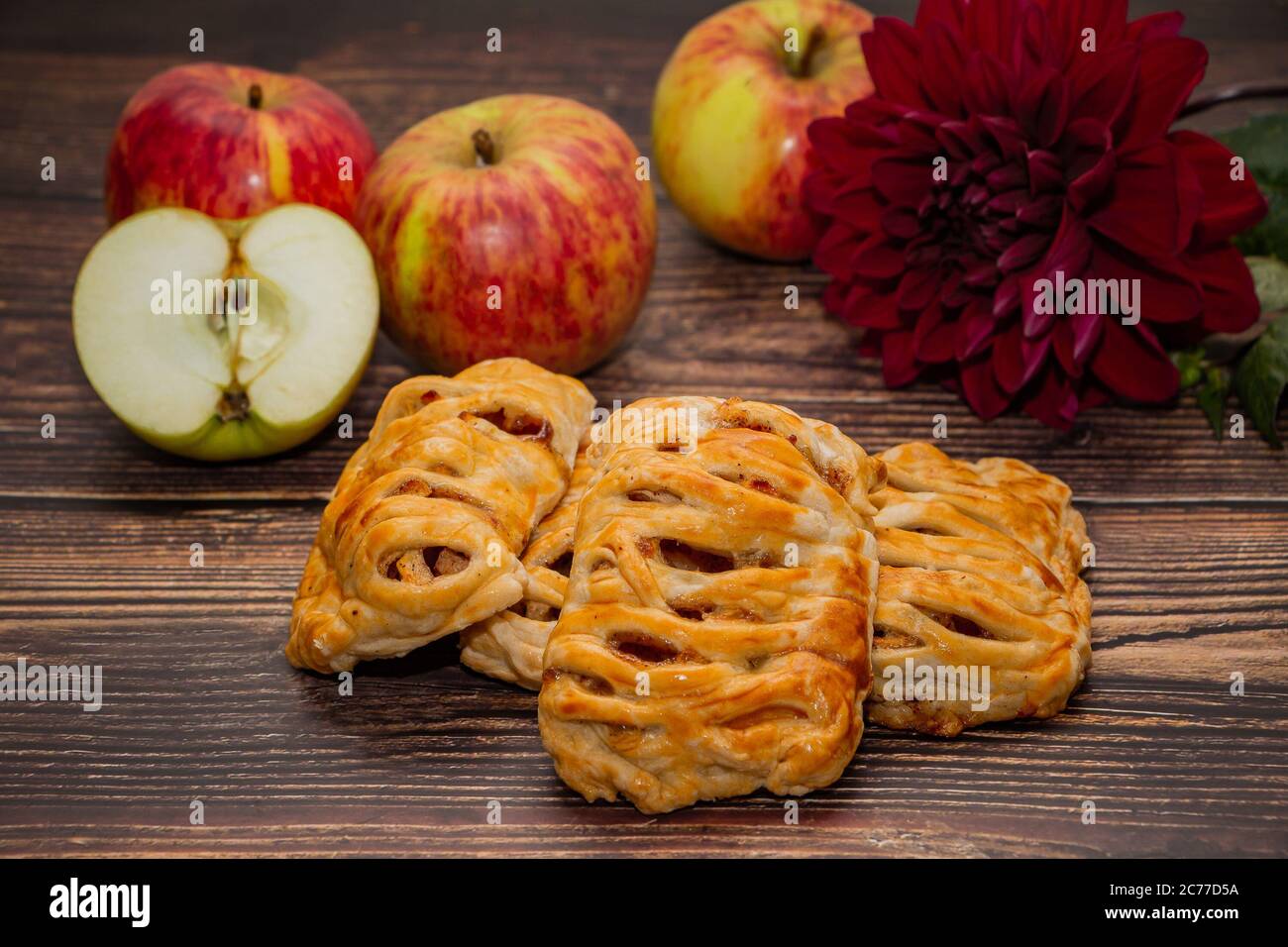 Sweet apple puff mini strudel on fruit background Stock Photo - Alamy