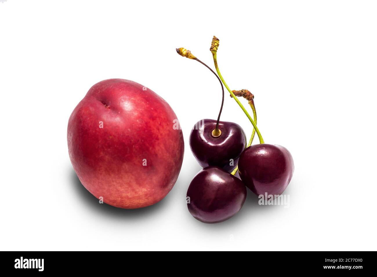 Juicy nectarine and ripe sweet cherries isolated on white background ...
