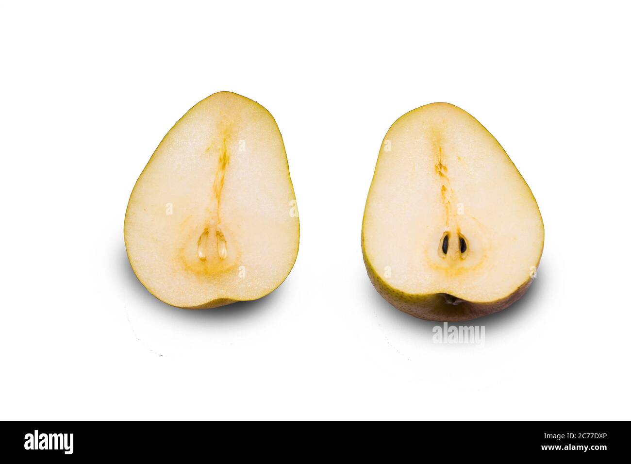 Pear cut in two isolated on a white background. Two half pears close-up ...