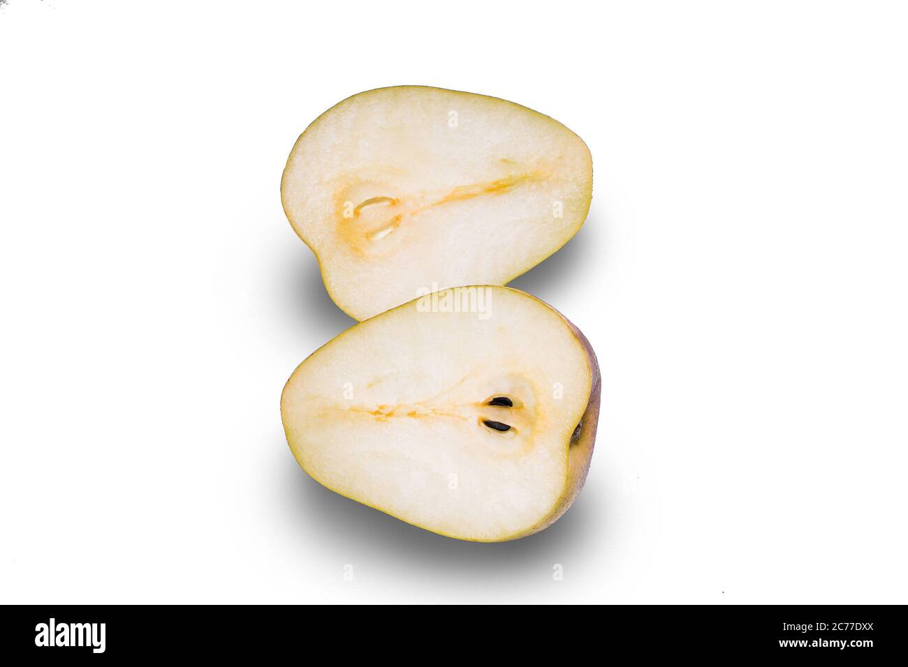 Pear cut in two isolated on a white background. Two half pears close-up ...