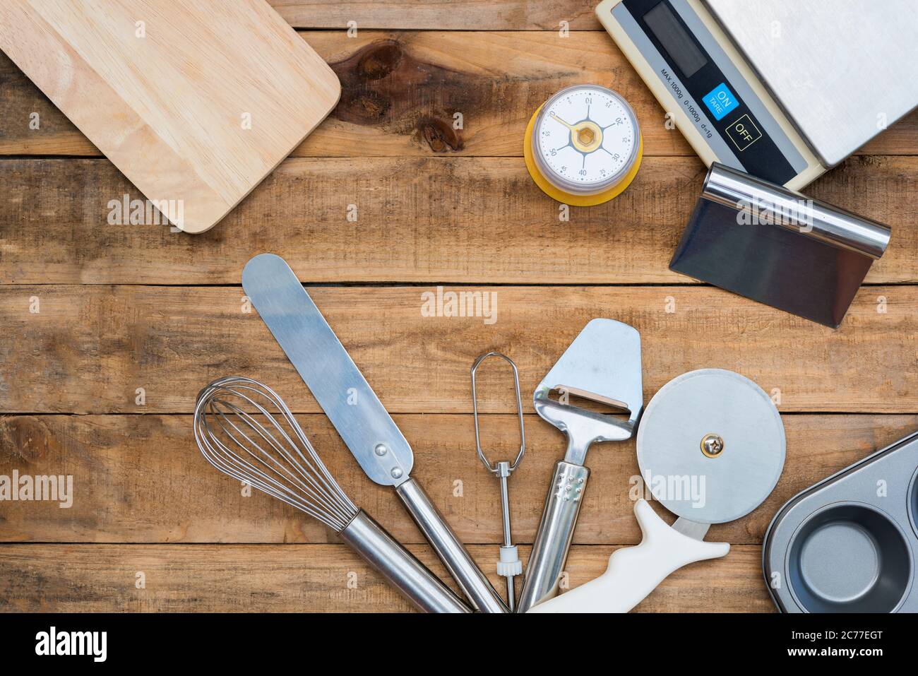 Bakery And Cooking Tools with kitchen timer, scales on wood table Stock ...