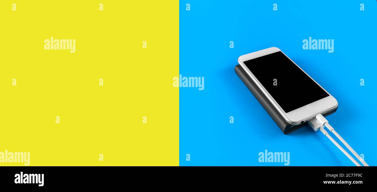 Top view smartphone charging with power bank on blue and empty yellow ...