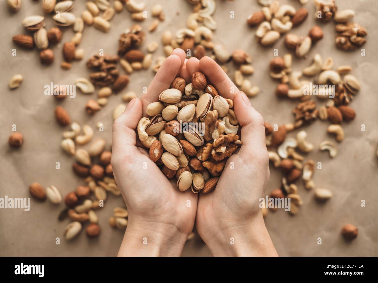 Different types of nuts, nut mix of almonds, hazelnuts, cashews ...