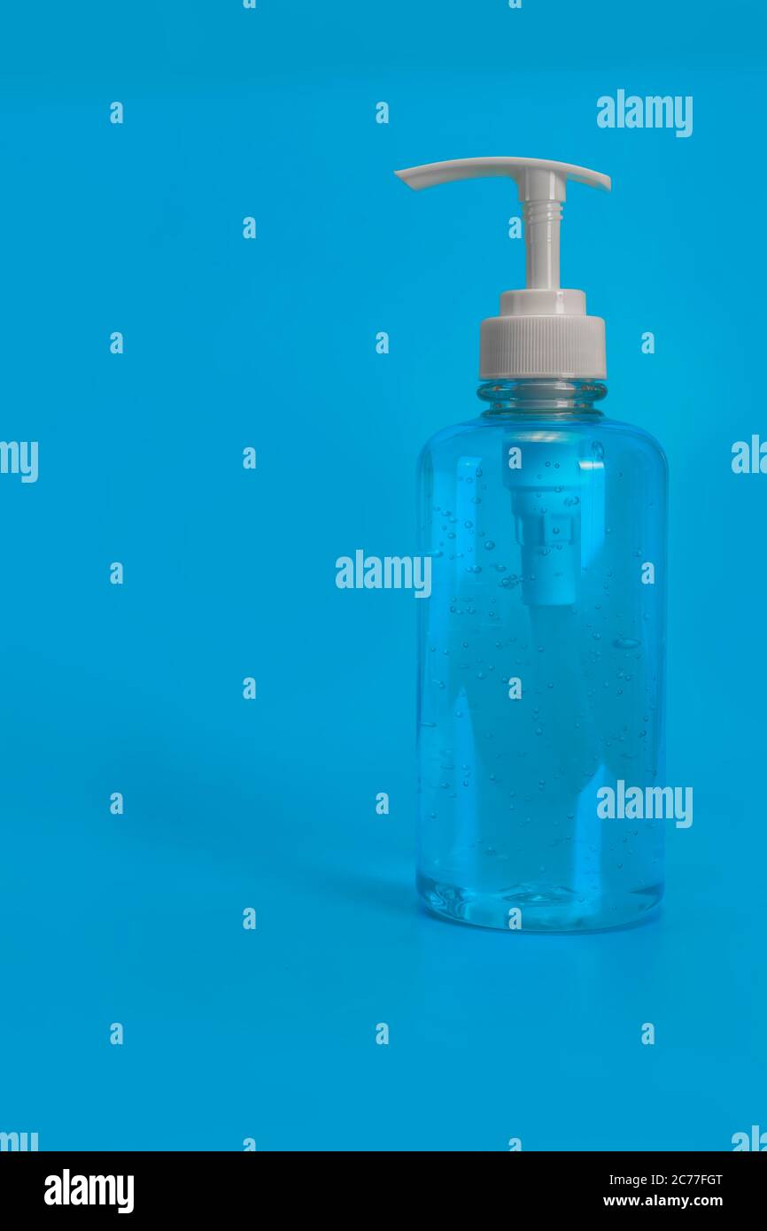 Blue alcohol gel isolated on blue background. Hand sanitizer gel for ...