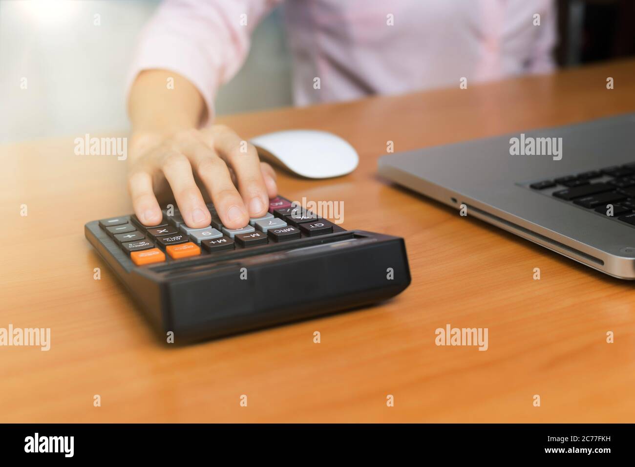 Women hand using calculator on office desk. Female hand press ...