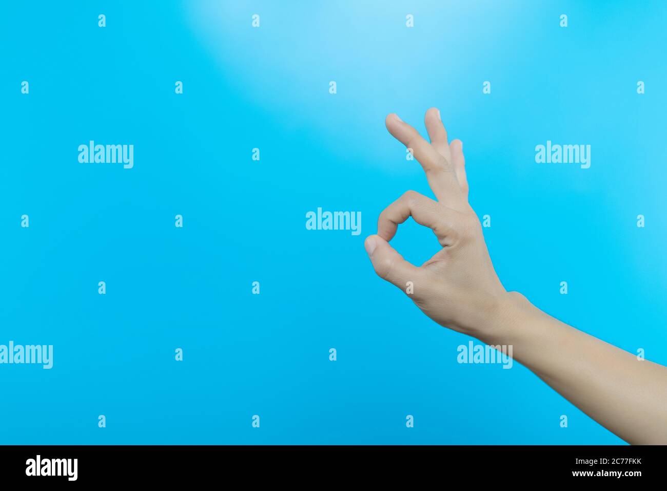 Women hand show gesturing sign on light blue background. human hand ...