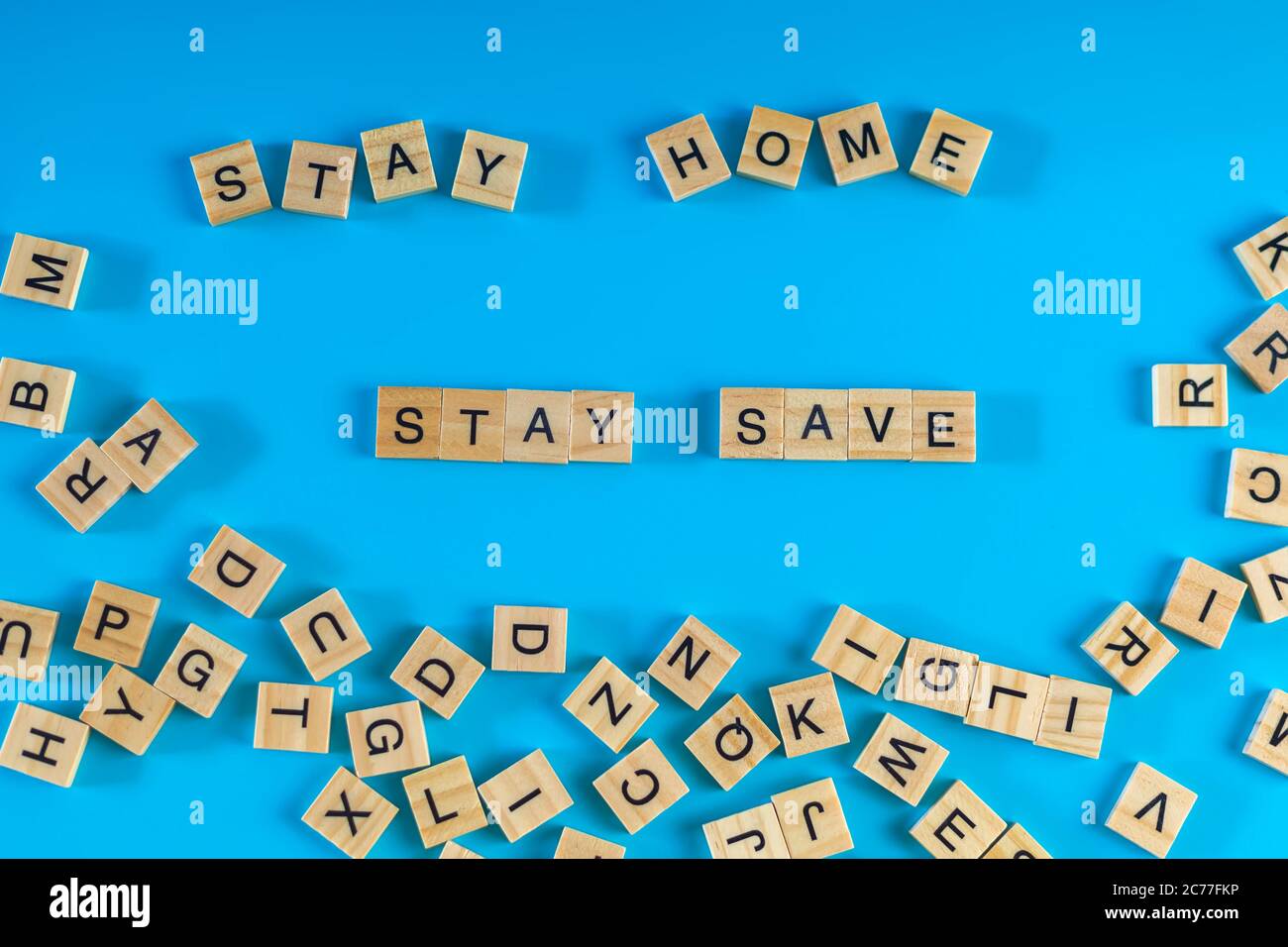 Top view wood block word stay home stay save and other character word ...