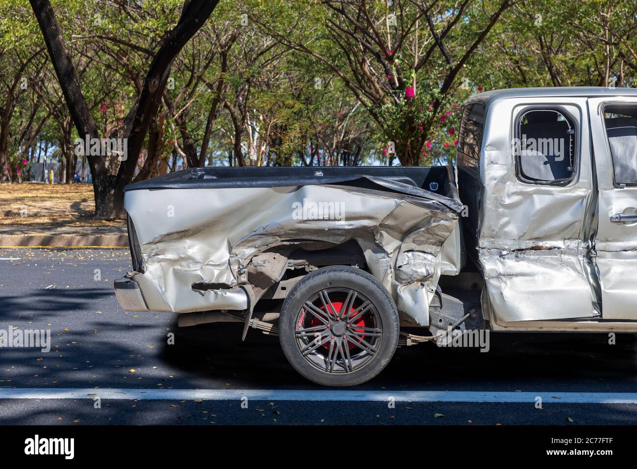 Back of gray color car big damaged and broken by accident on city ...