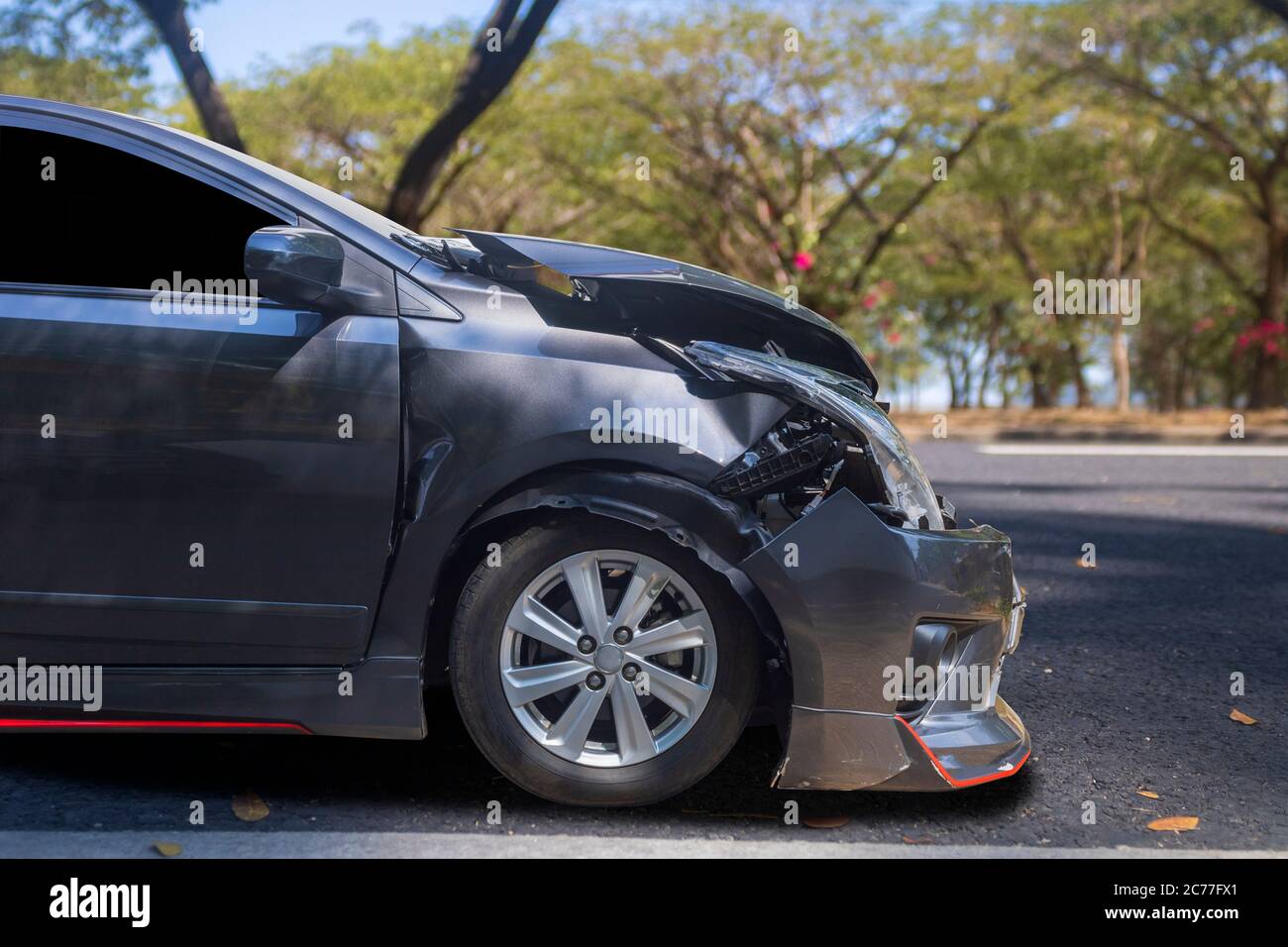 Front of gray color car big damaged and broken by accident on city ...