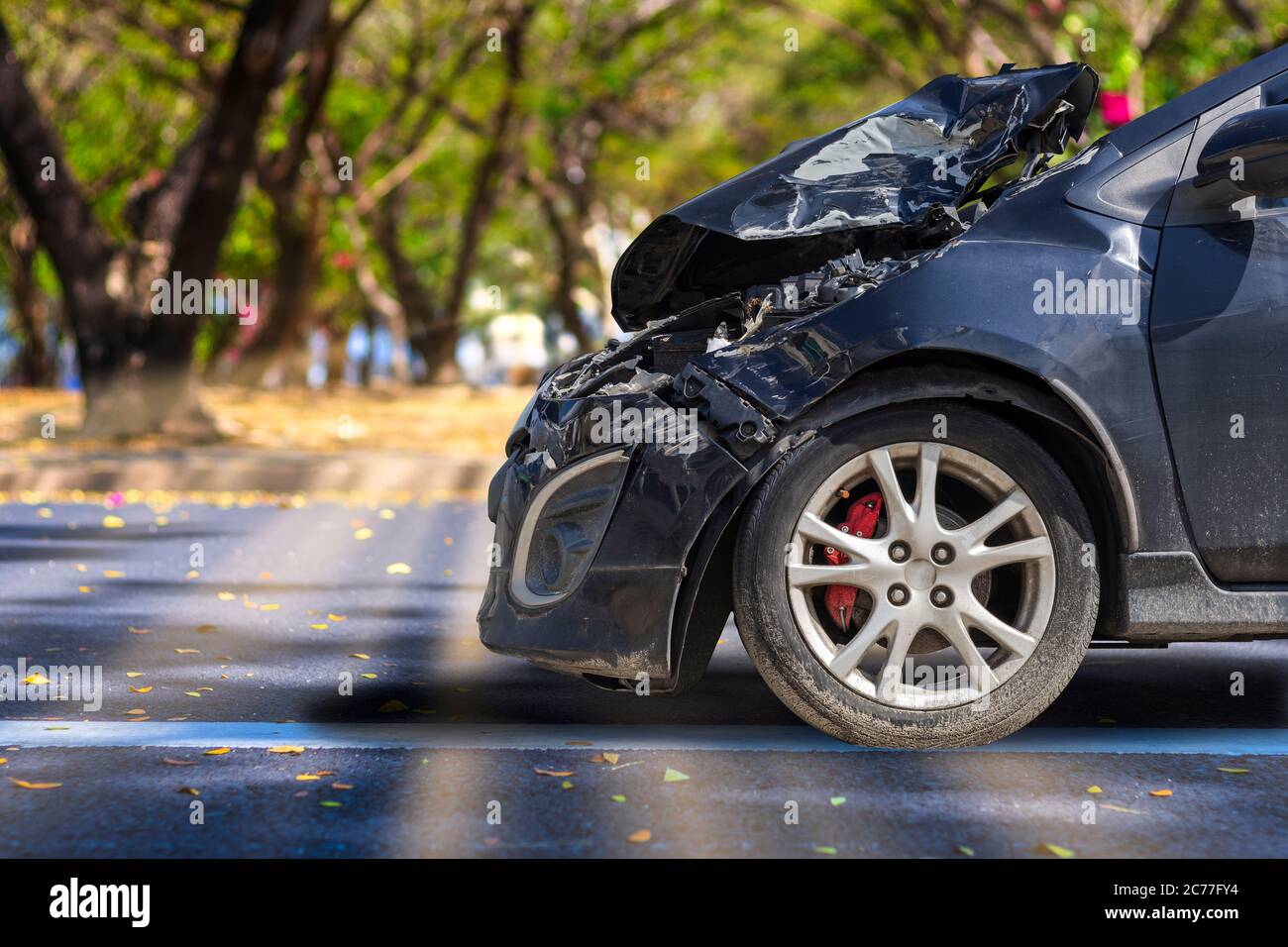 Front of black color car big damaged and broken by accident on city ...