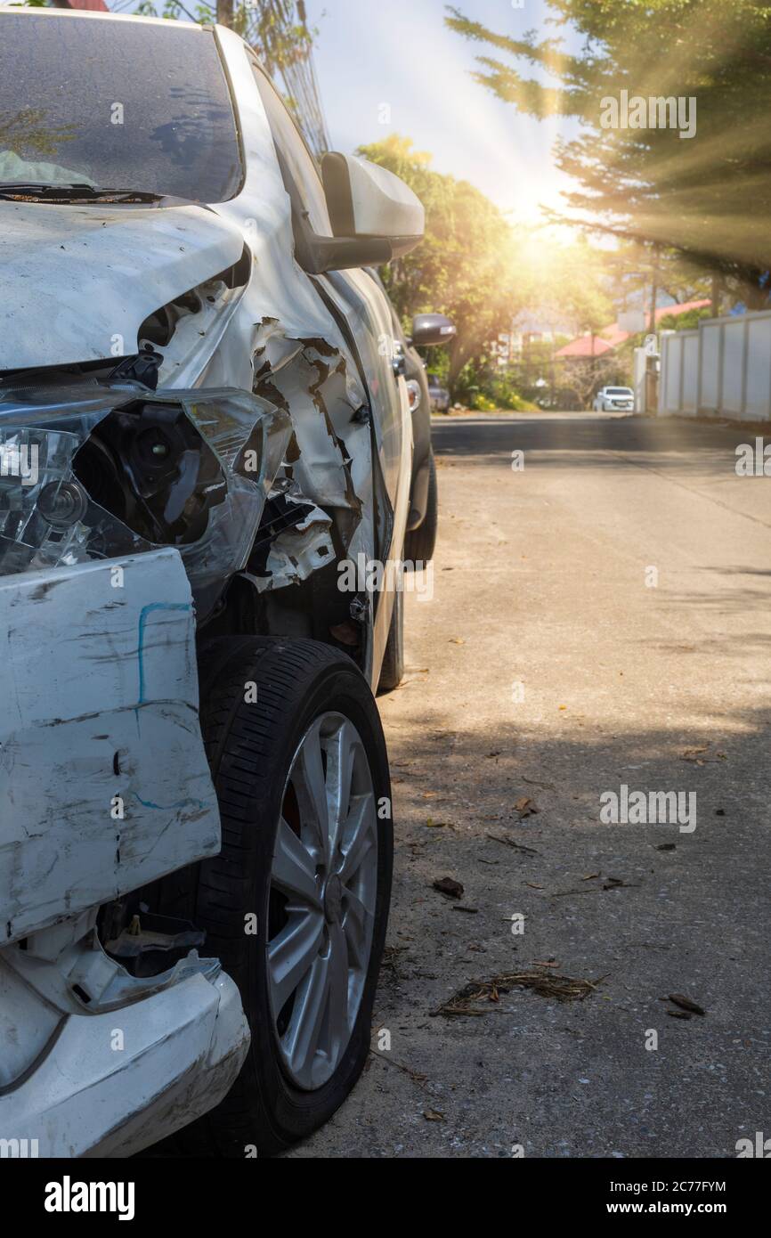 Front of white color car big damaged and broken by accident on city ...