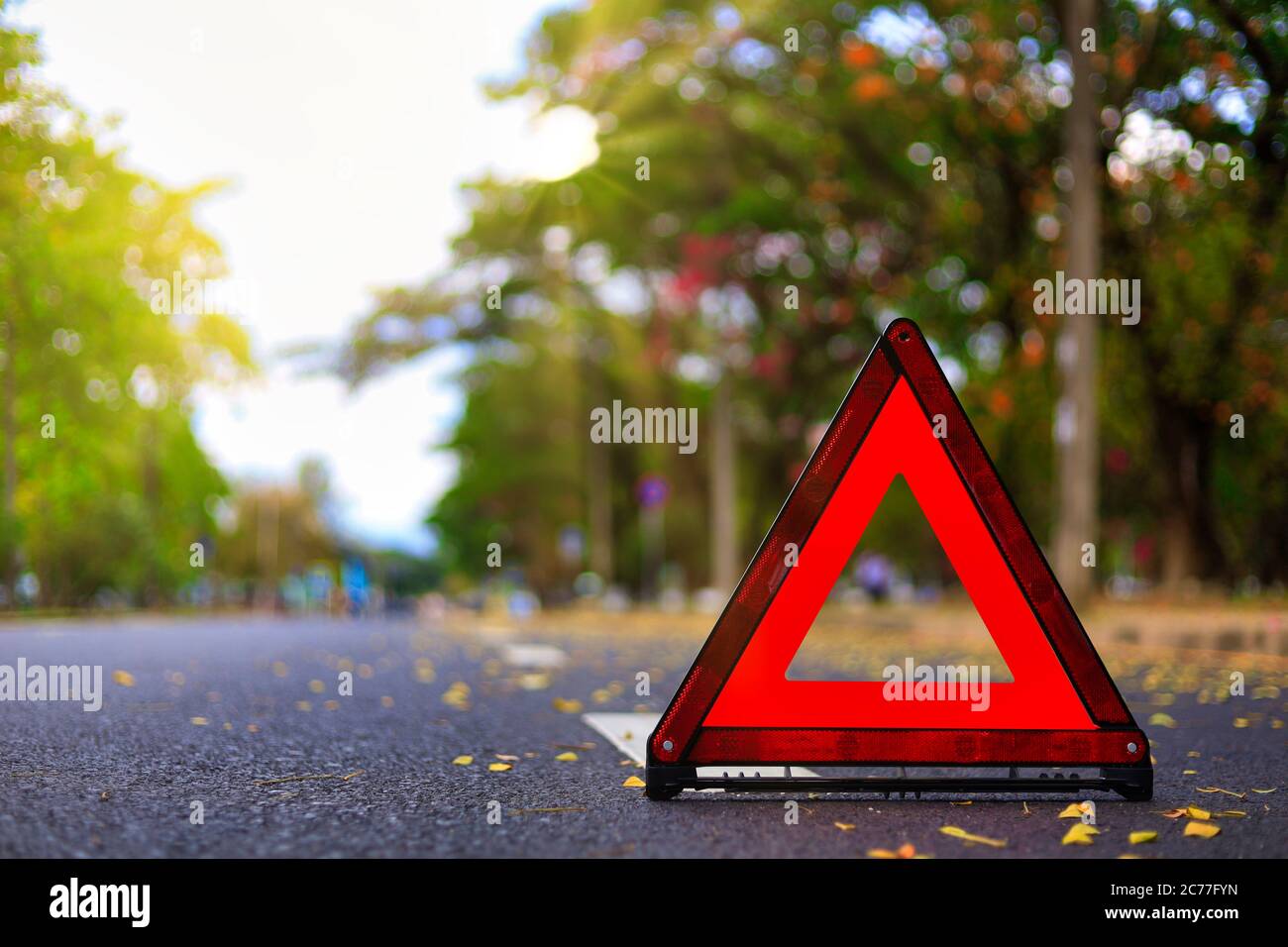 Red triangle, red emergency stop sign, red emergency symbol on road ...